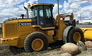 Tractor (payloader) - The Review Newspaper